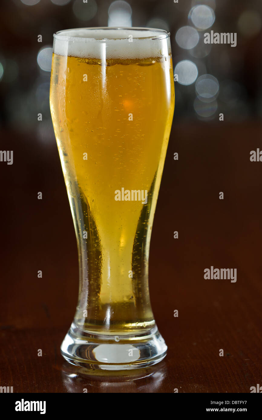 single beer served in a bar with an out of focus background Stock Photo ...
