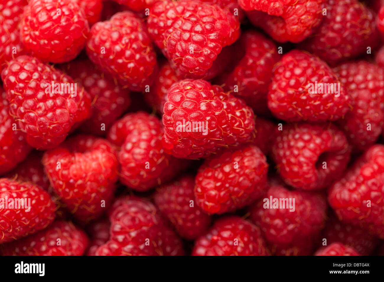 Red ripe fresh raspberry background Stock Photo - Alamy