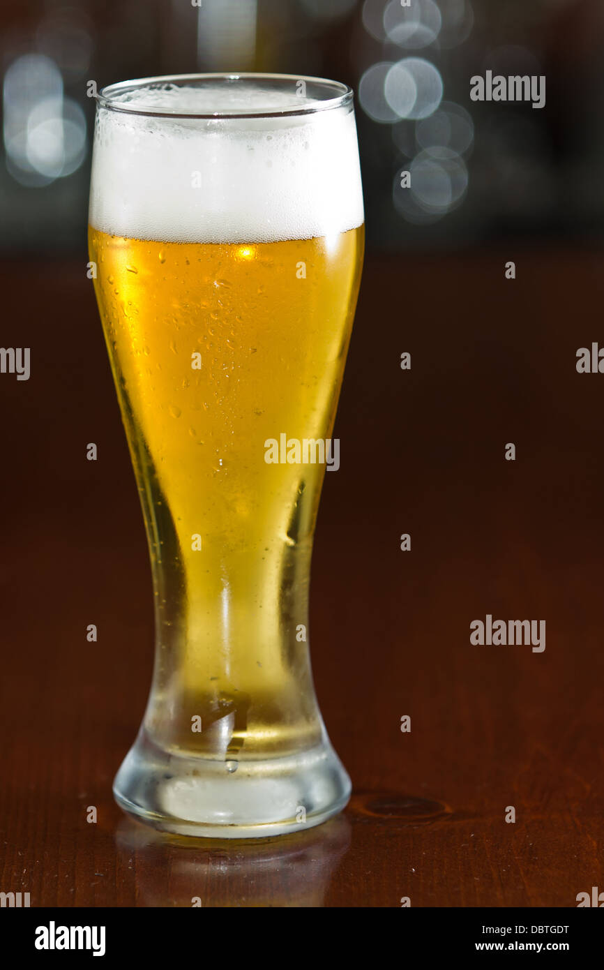 single beer served in a bar with an out of focus background Stock Photo ...