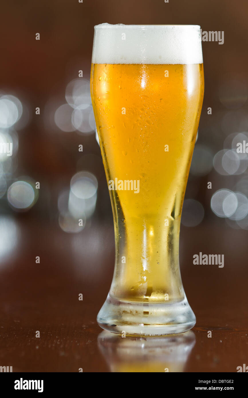 single beer served in a bar with an out of focus background Stock Photo ...