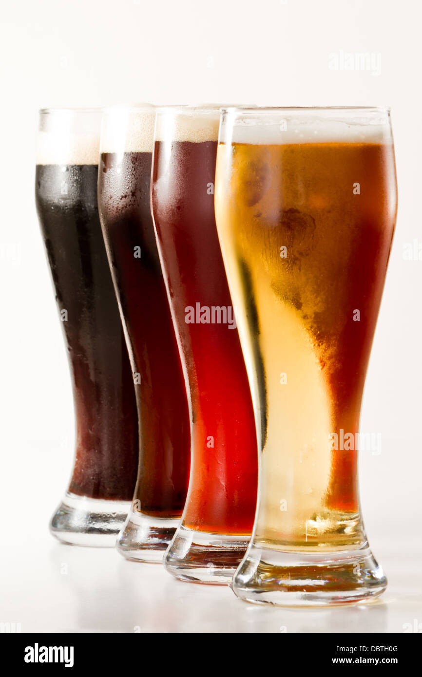 row of beers isolated on a white background from light to dark Stock ...