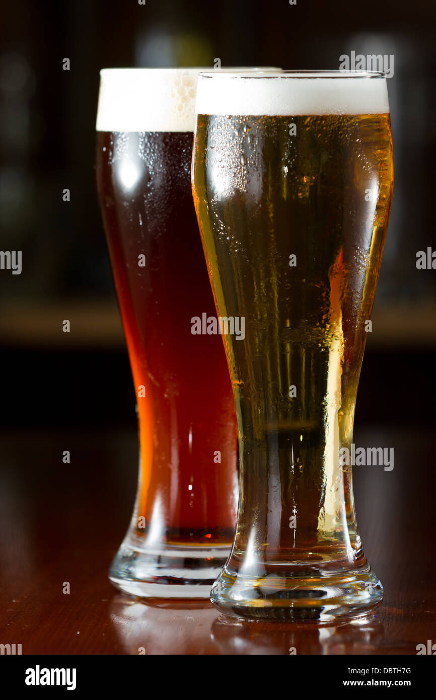ice cold beers served in a cold glass on a dark bar Stock Photo - Alamy