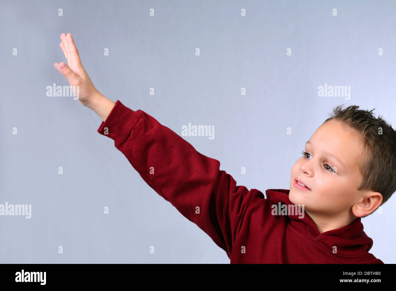 close-up of cute little boy reaching out Stock Photo - Alamy