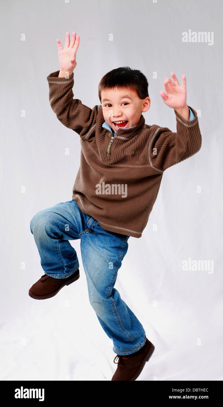 cute asian boy jumping in the air Stock Photo - Alamy