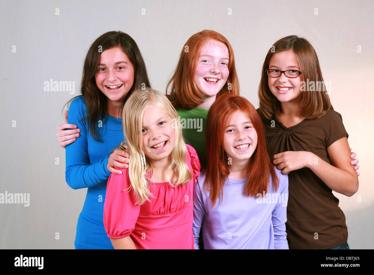 diverse group of cute young girls laughing Stock Photo - Alamy