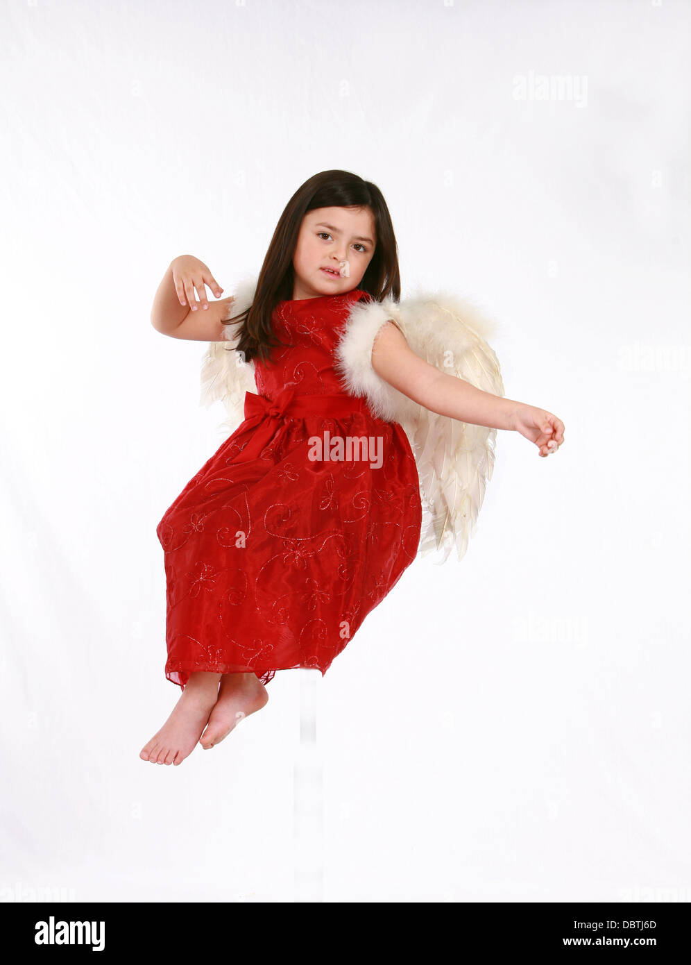 pretty little girl in angel wings floating Stock Photo - Alamy