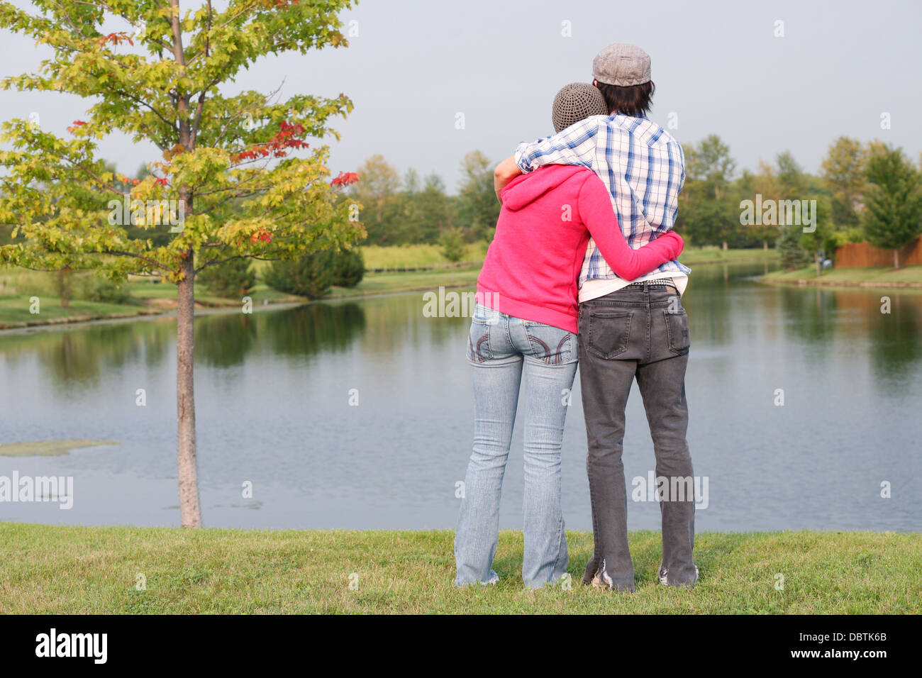 rear view of couple by a lake Stock Photo - Alamy