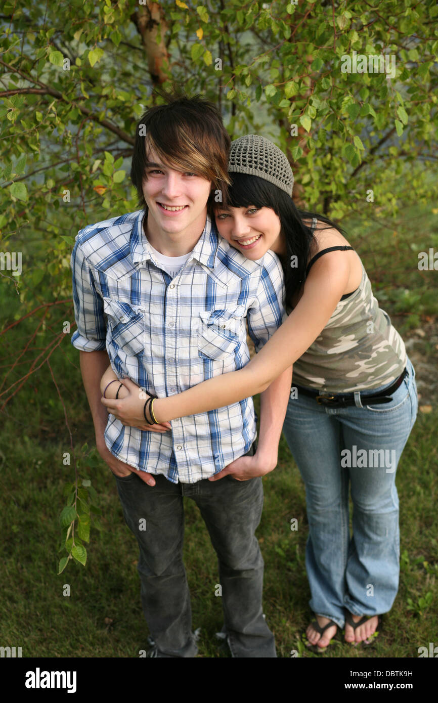 Adorable teen couple hugging outside Stock Photo - Alamy
