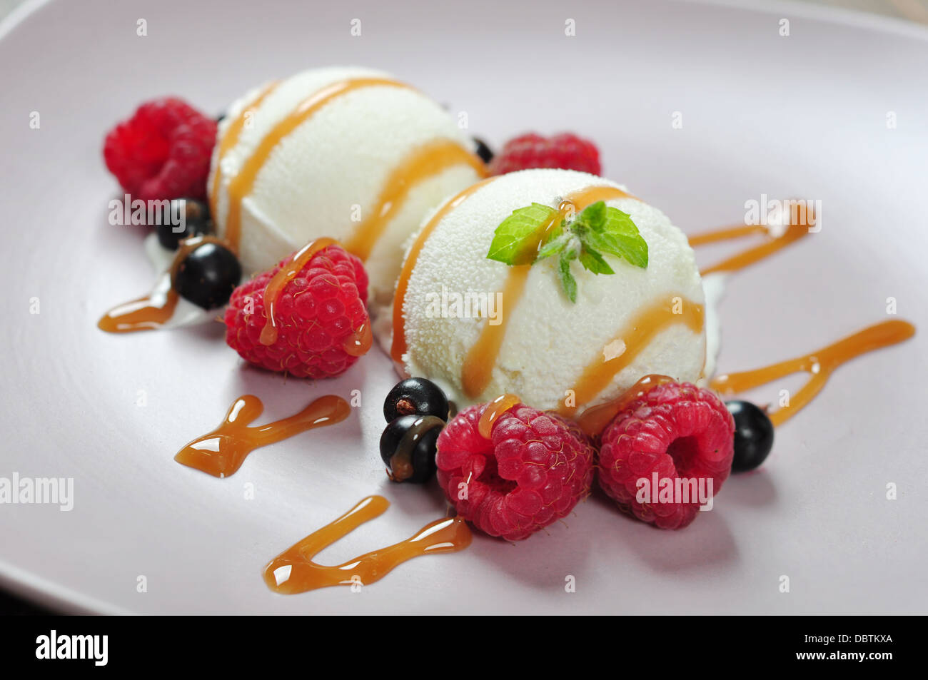 ice cream sundae with fresh raspberry and blackcurrant Stock Photo - Alamy