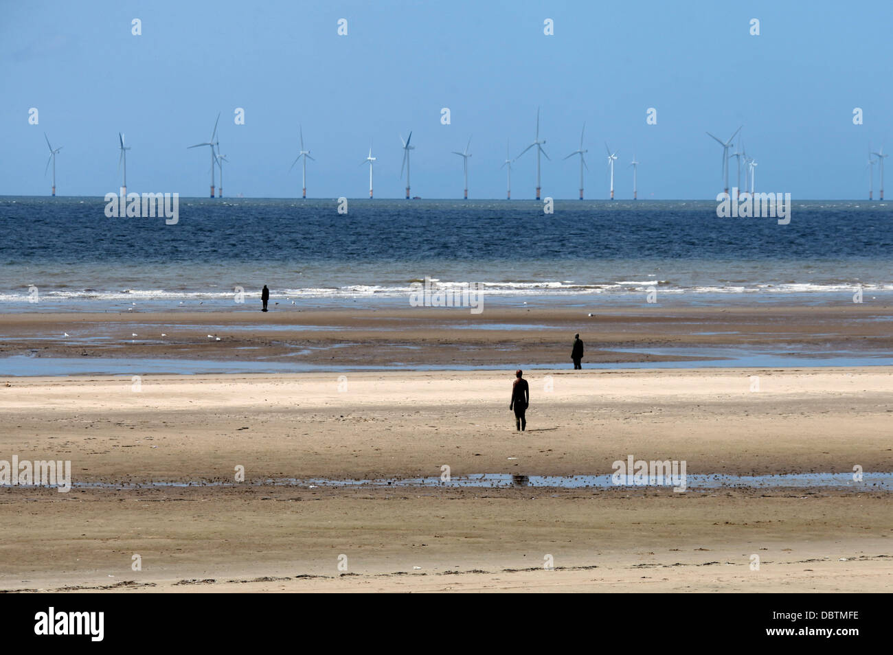 Liverpool Bay Wind Farm behind the figures of Another Place art work by ...