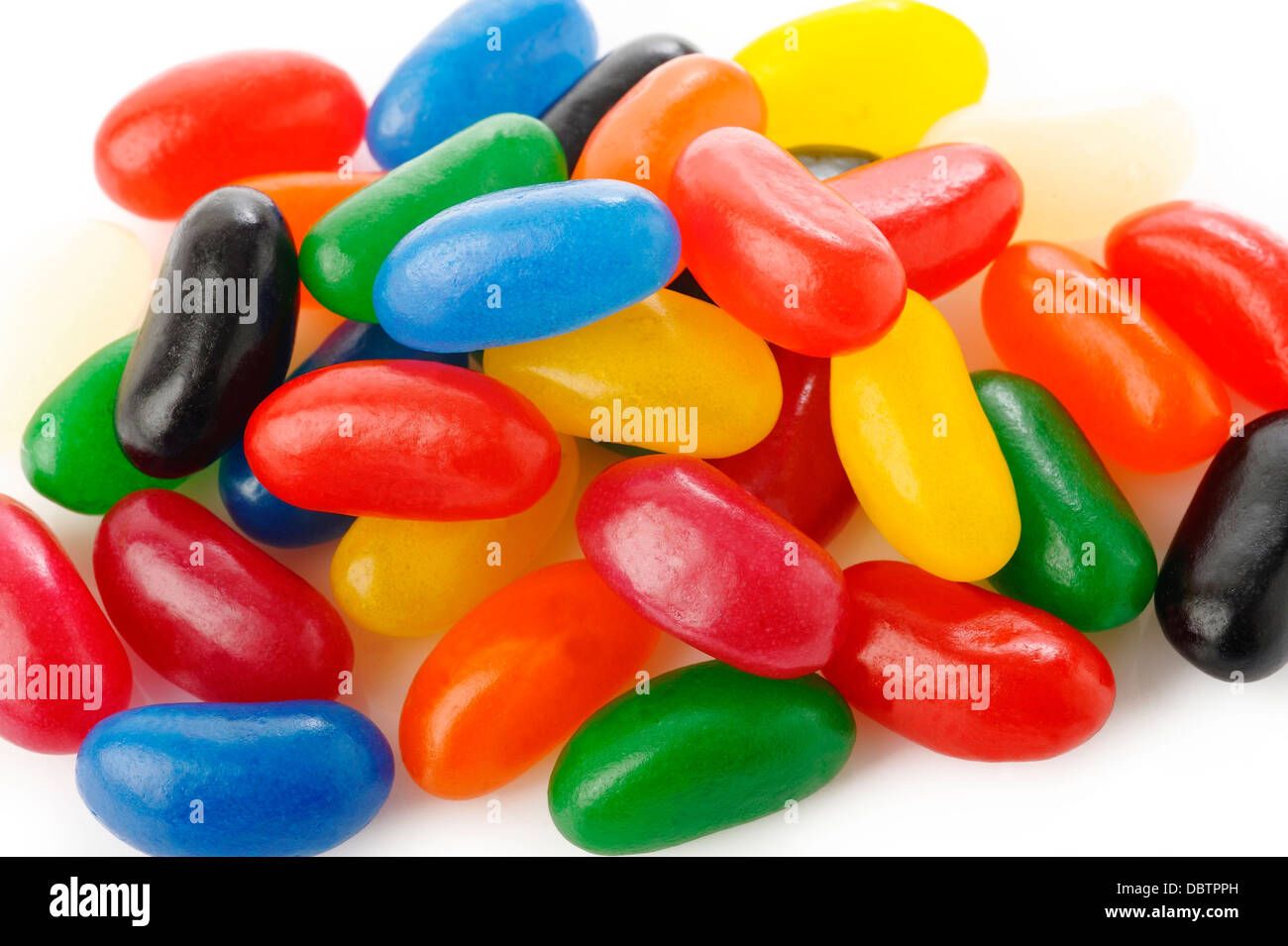 multi colour jelly beans on white background Stock Photo - Alamy