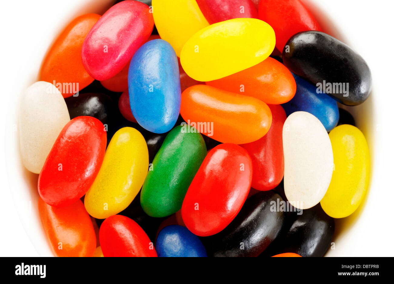 multi colour jelly beans on white background Stock Photo - Alamy