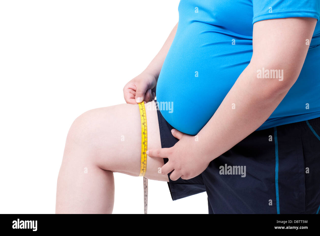 Obese man measuring thigh size with tape measure, midsection Stock ...