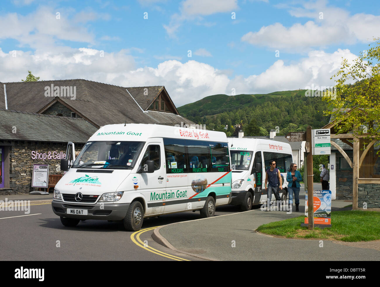 Two Mountain Goat minibuses parked in the village of Hawkshead, Lake ...