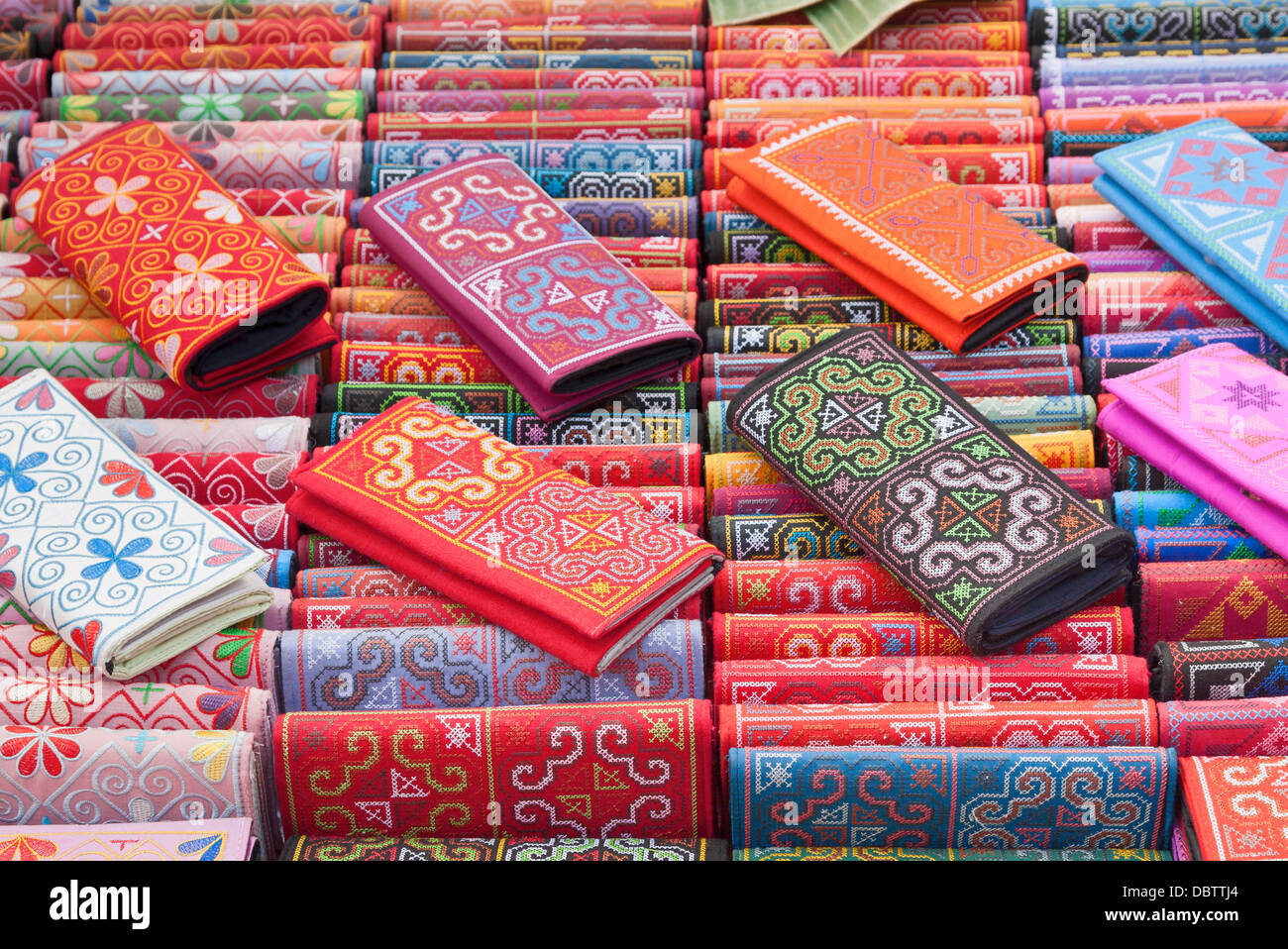 Colourful traditional wallets on display at a market stall in Luang ...