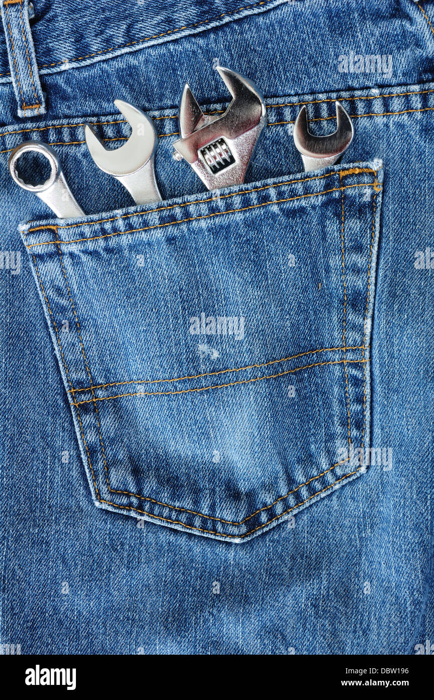 DIY / workman's hand tools in the back pocket of a pair of denim jeans ...