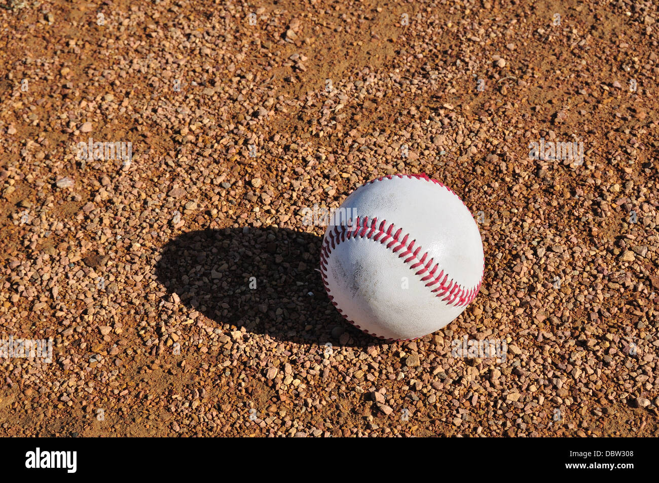 Baseball on the ground on a baseball diamond Stock Photo - Alamy