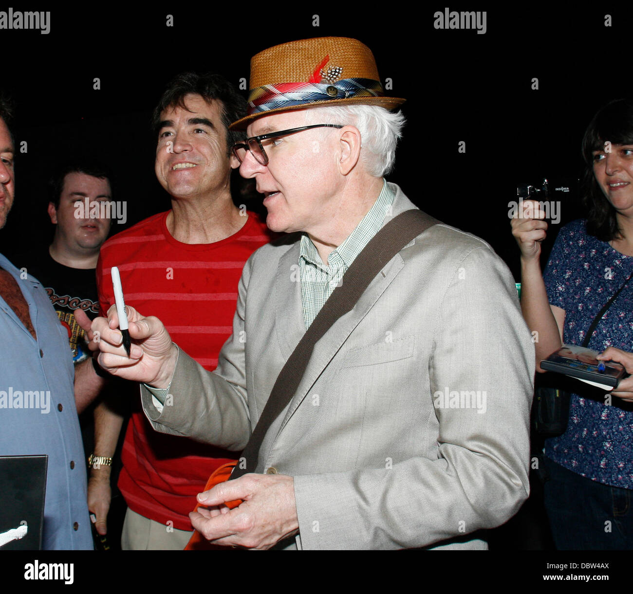 Steve Martin signs autographs after his bluegrass music concert in ...