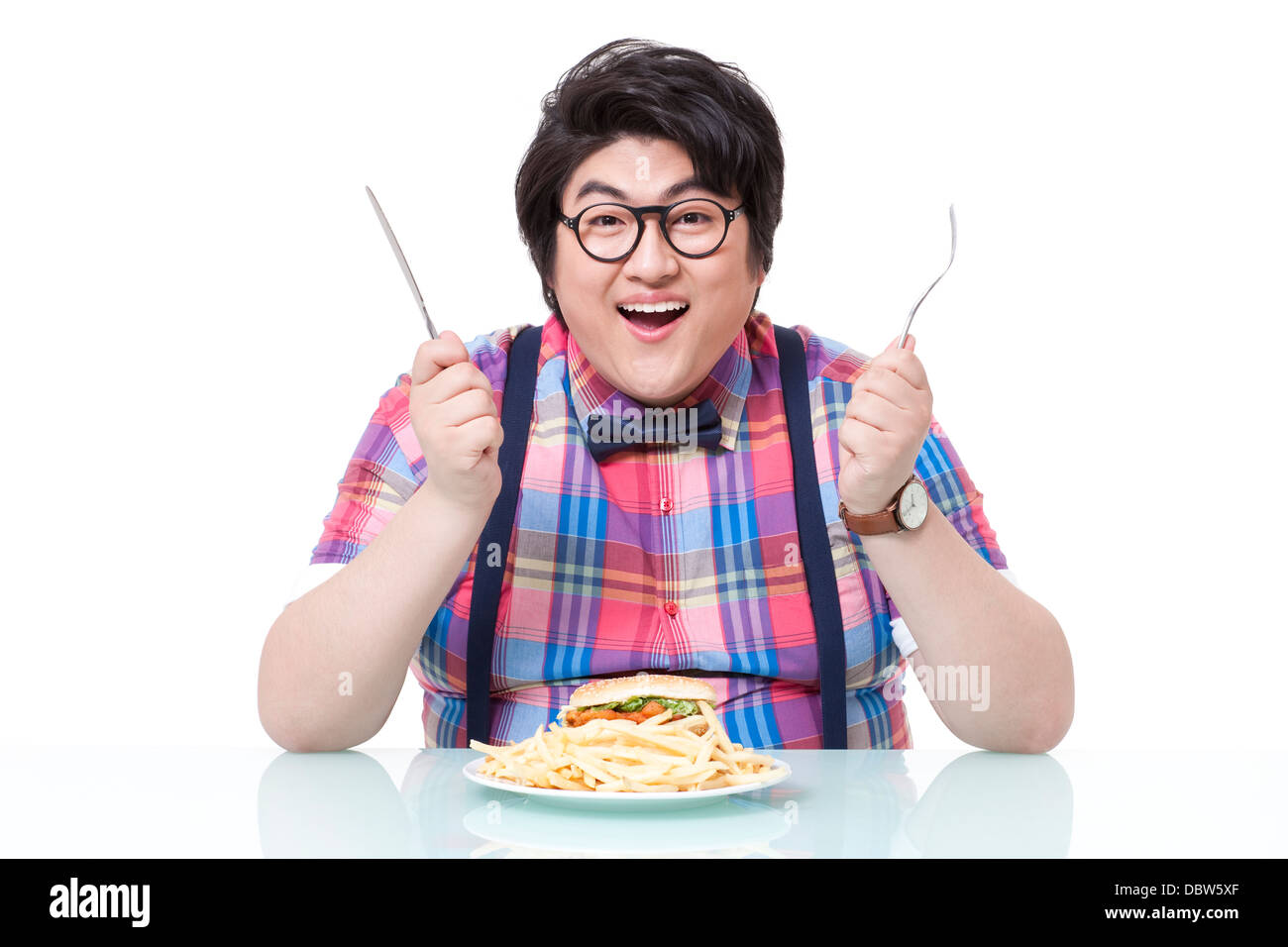 Happy overweight man enjoying burger and chips Stock Photo - Alamy