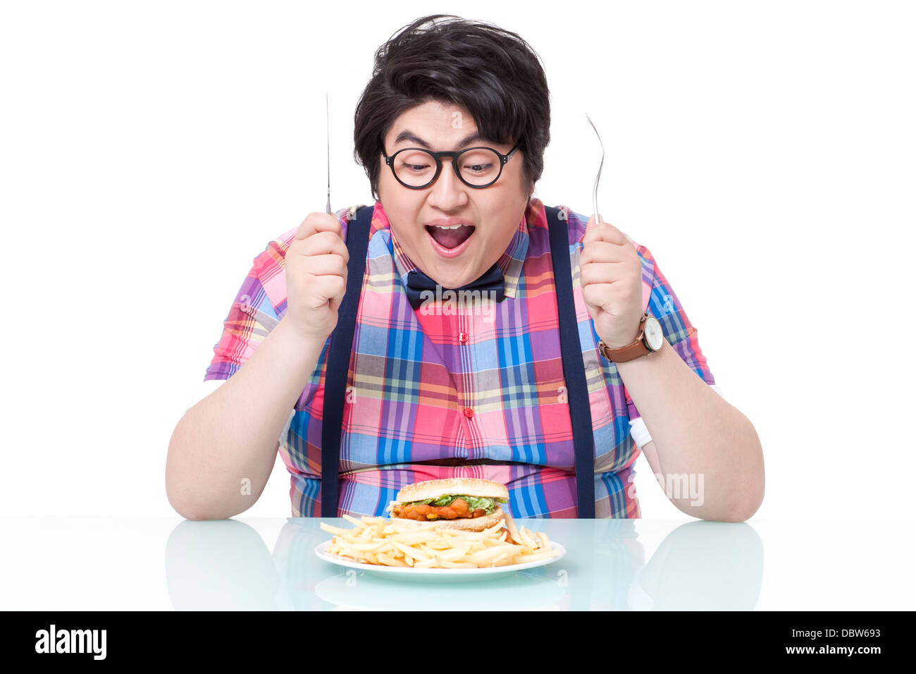 Happy overweight man enjoying burger and chips Stock Photo - Alamy