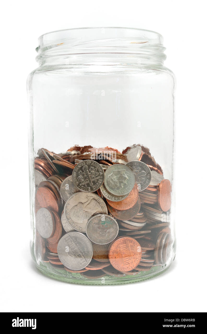 US coins in a glass jar on white background Stock Photo - Alamy