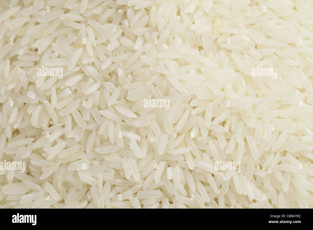 Background of the raw rice Stock Photo - Alamy