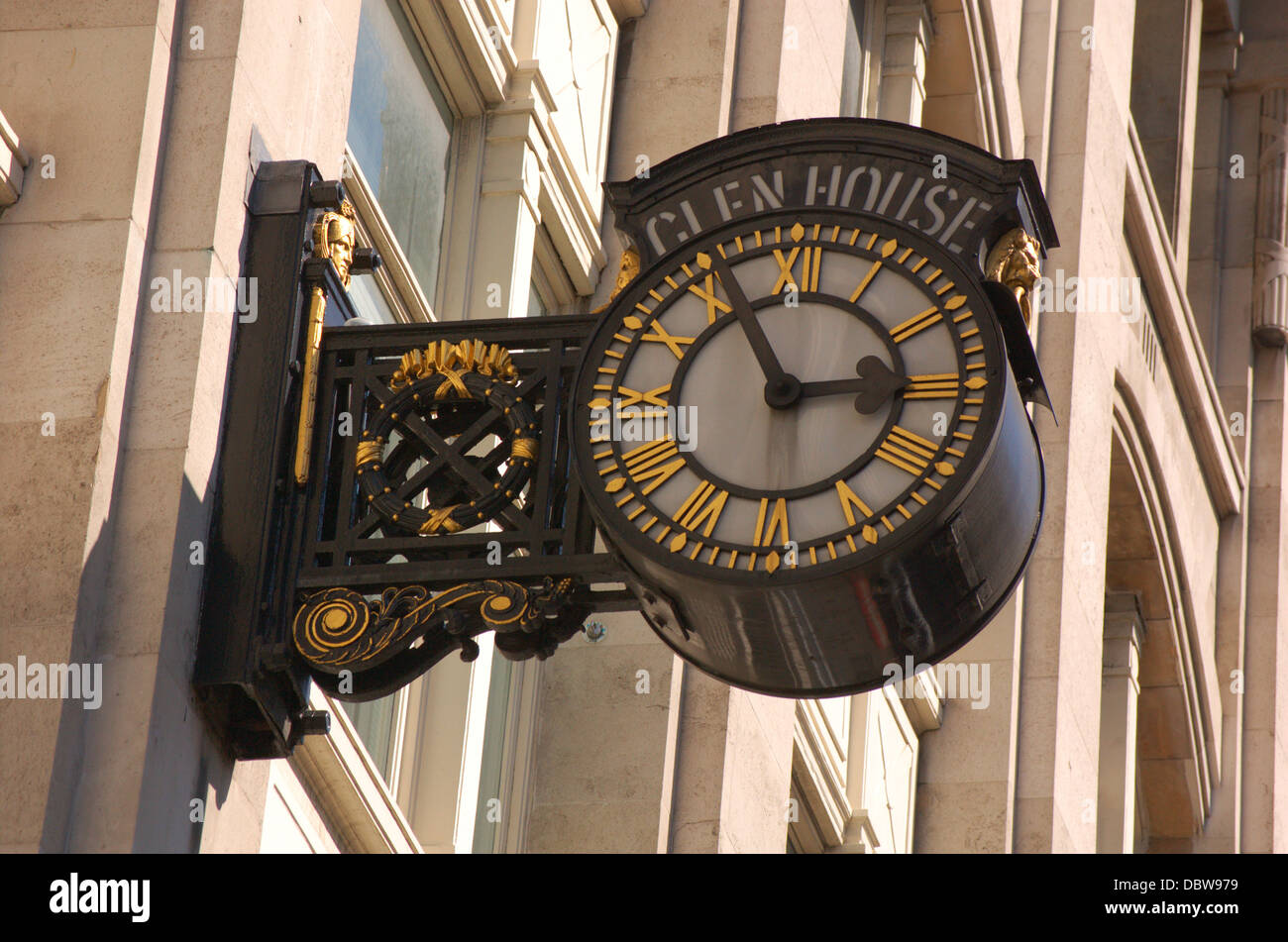 Exterior wall clock on a London building Stock Photo - Alamy