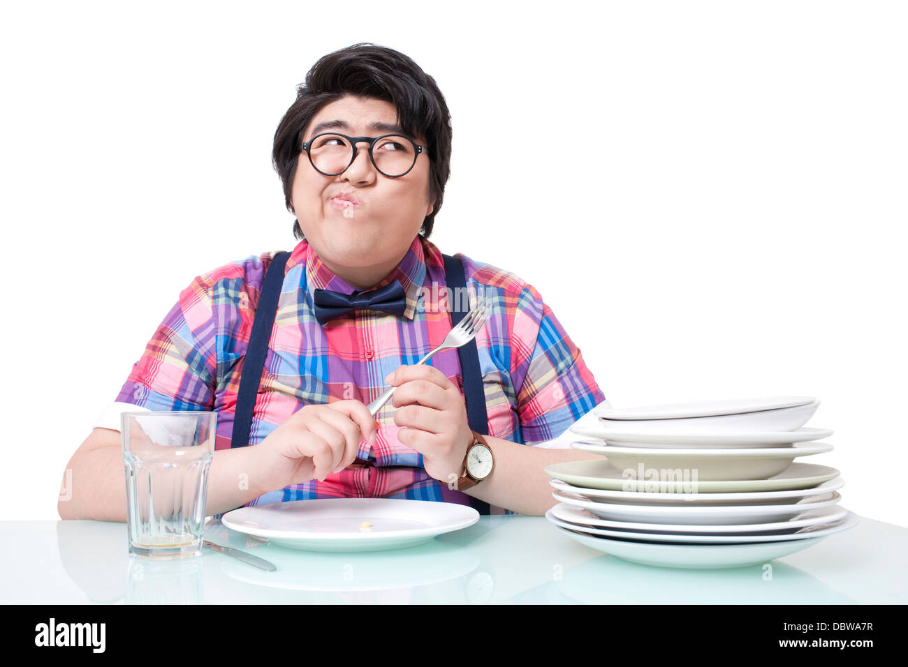 Overweight young man after a big meal Stock Photo - Alamy