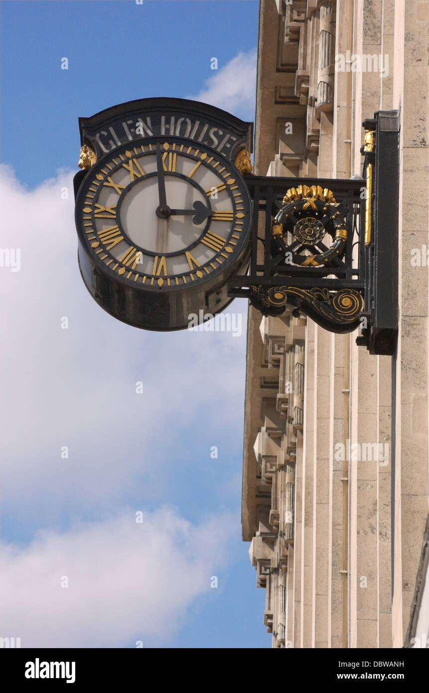 Exterior wall clock on a London building Stock Photo - Alamy