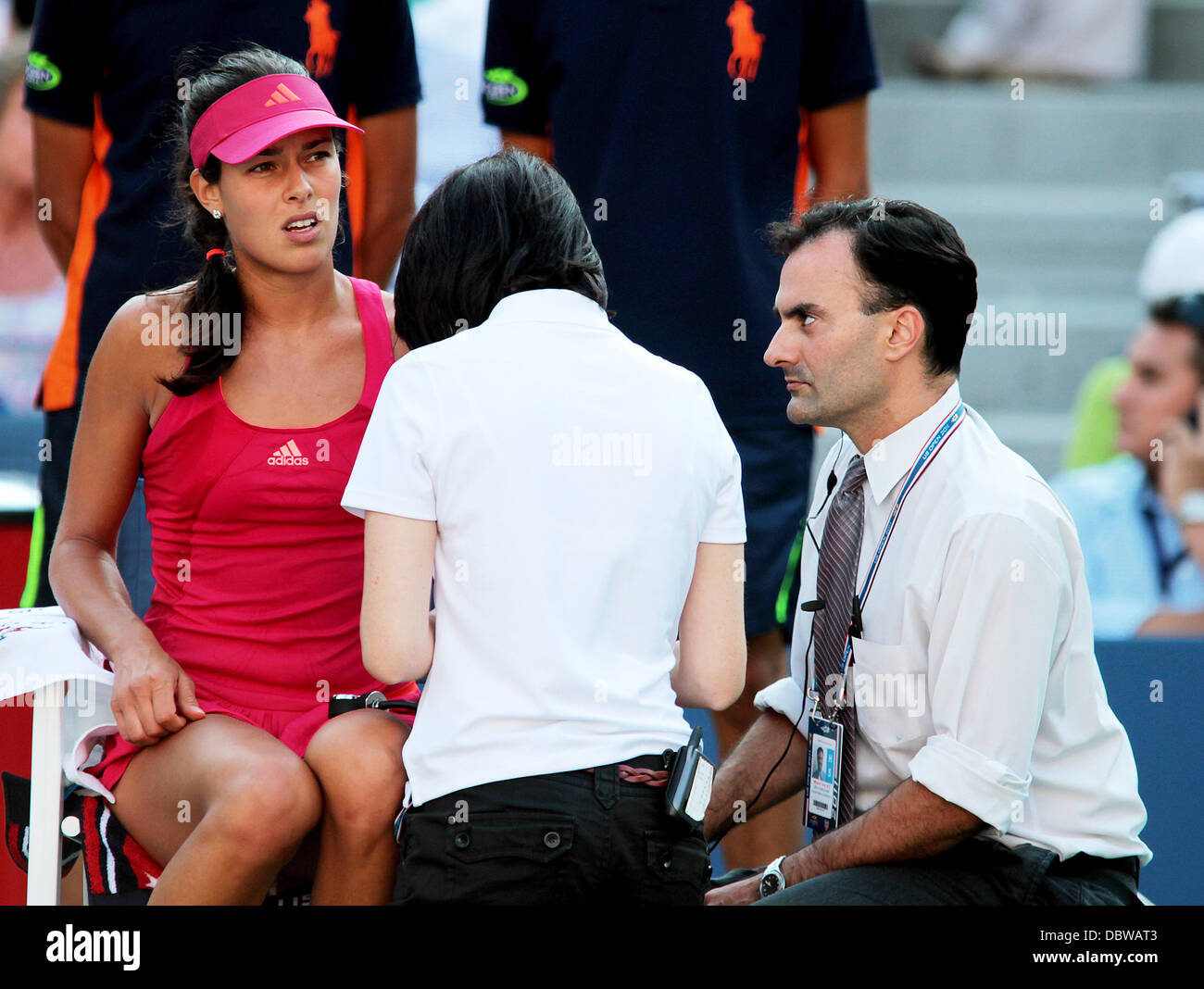 Anna Ivanovic, of SEB, is attended by USTA medical staff, as they check ...