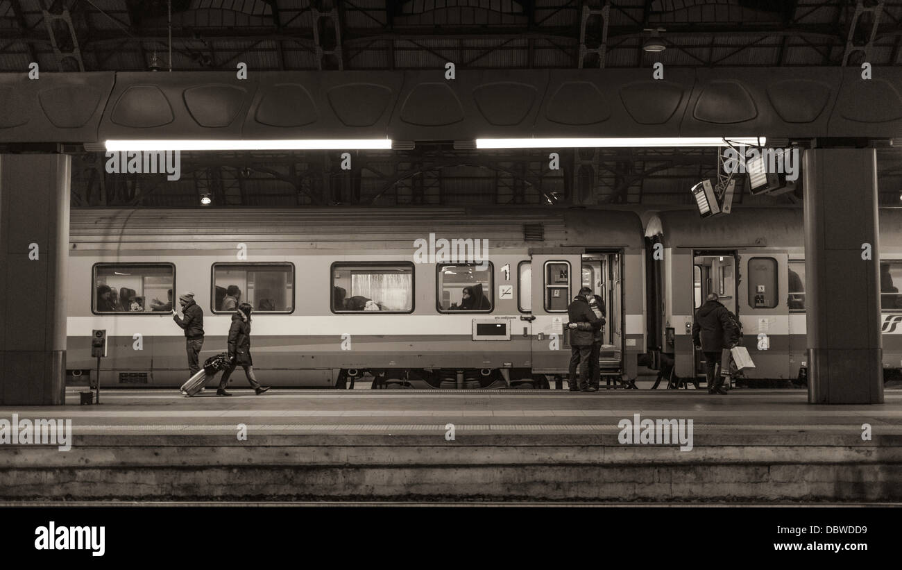 People taking the train at the station Stock Photo - Alamy