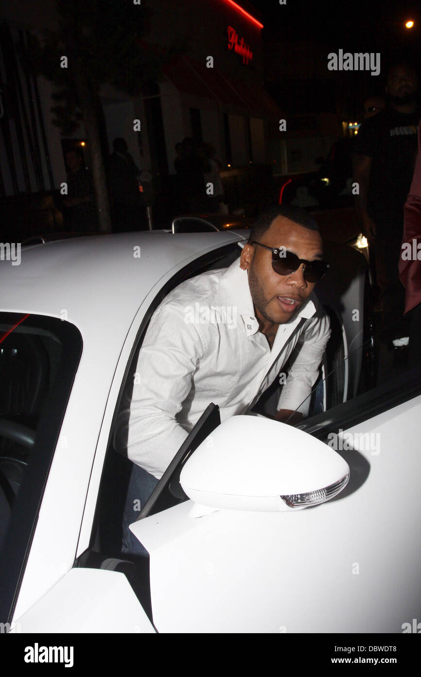 Rapper Flo Rida arrives at Philipe Chow restaurant in a white sports ...