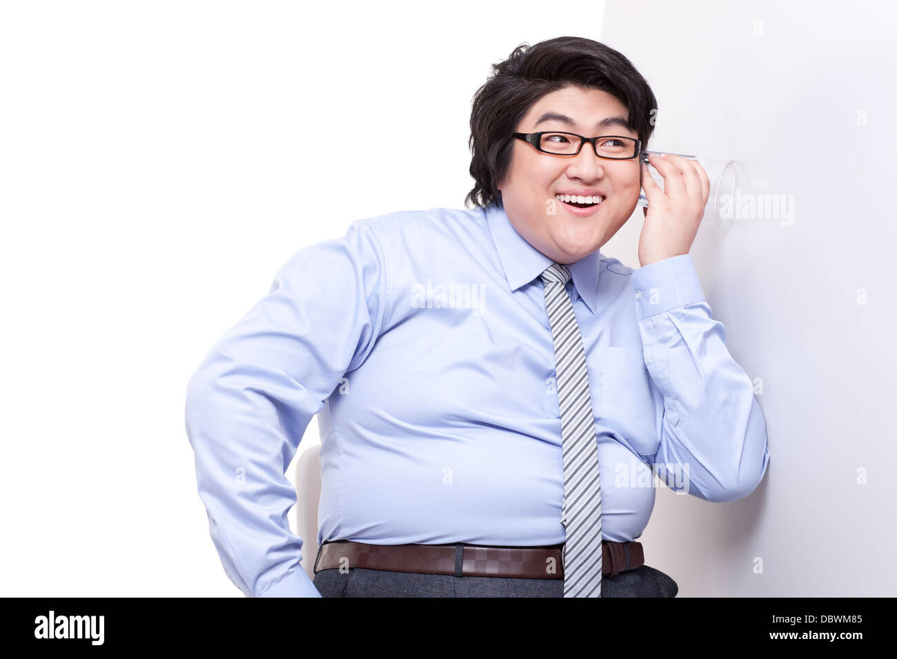 Smiling overweight man listening hi-res stock photography and images ...