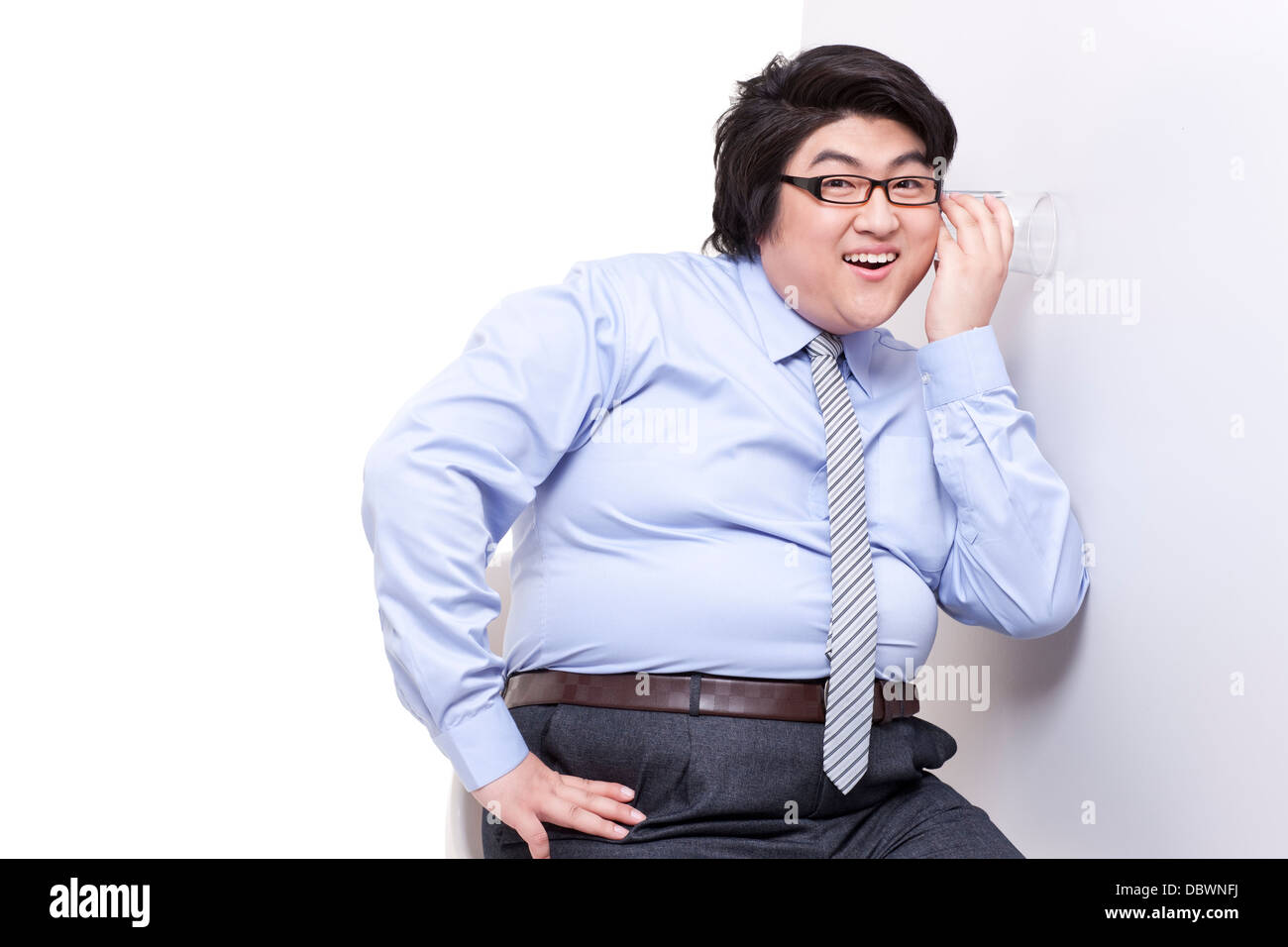 Smiling overweight man listening hi-res stock photography and images ...