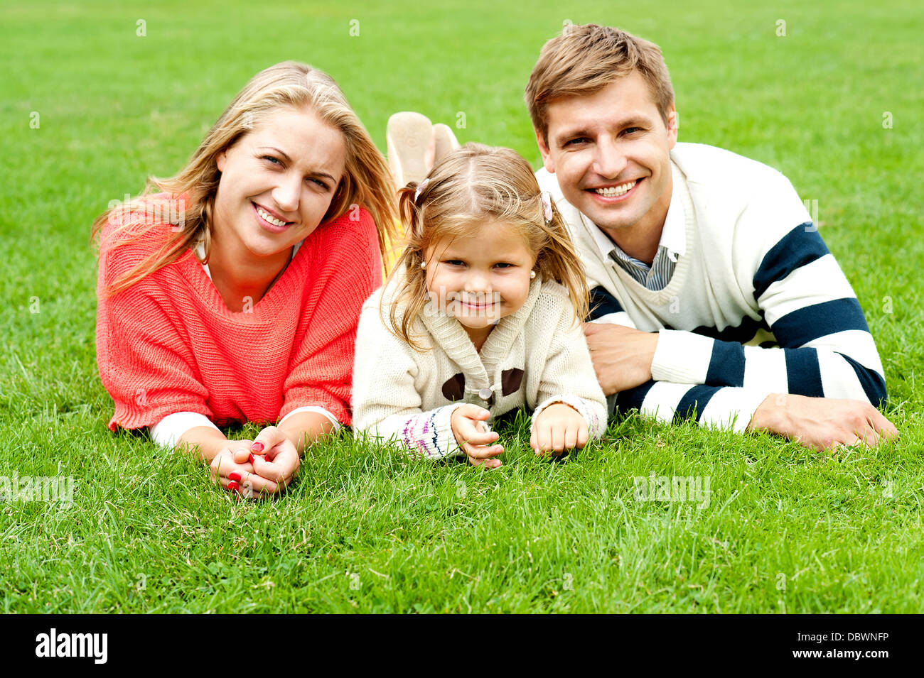 Portrait of a happy family of three Stock Photo - Alamy