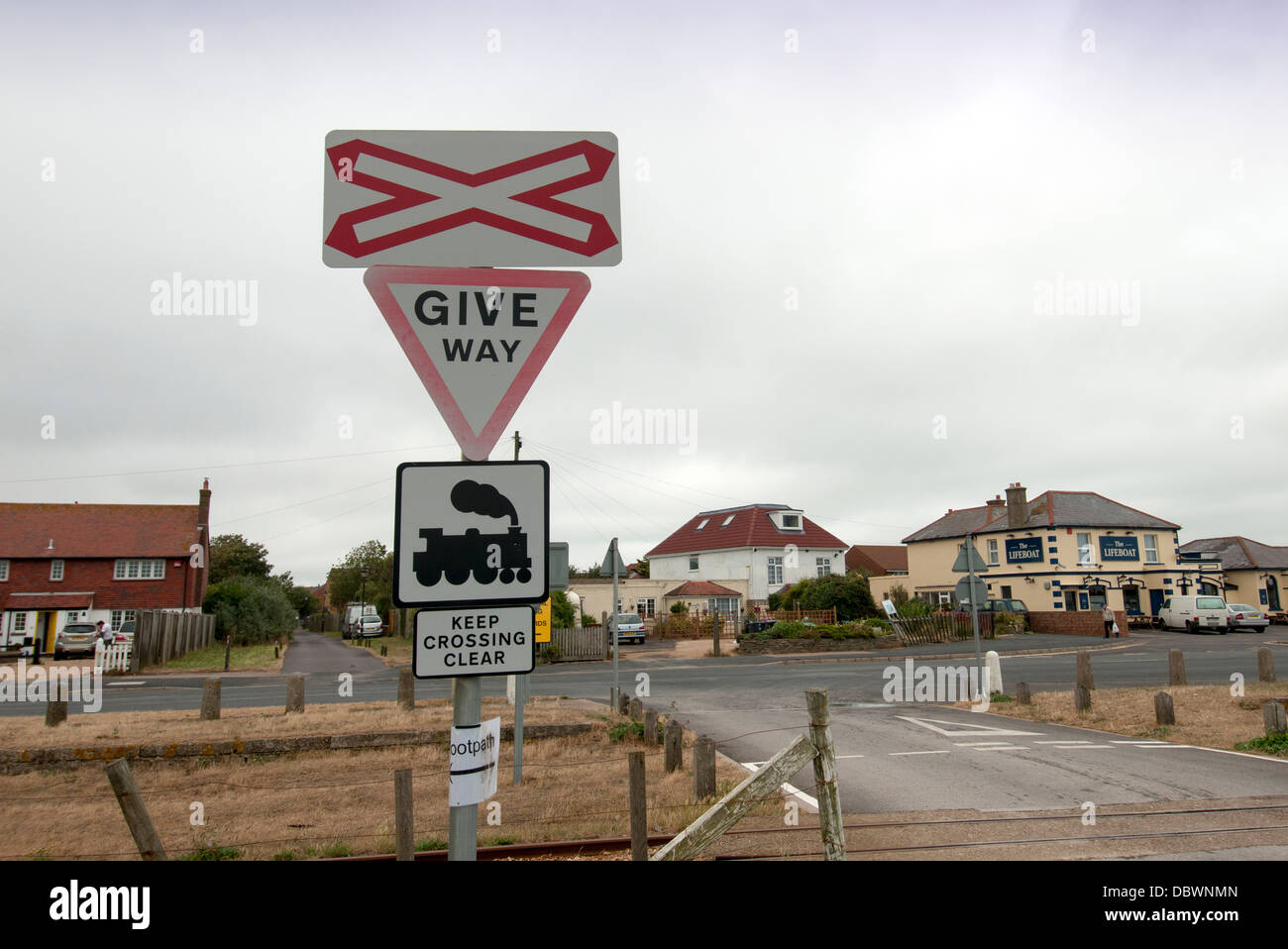train level crossing with warning signs Stock Photo - Alamy
