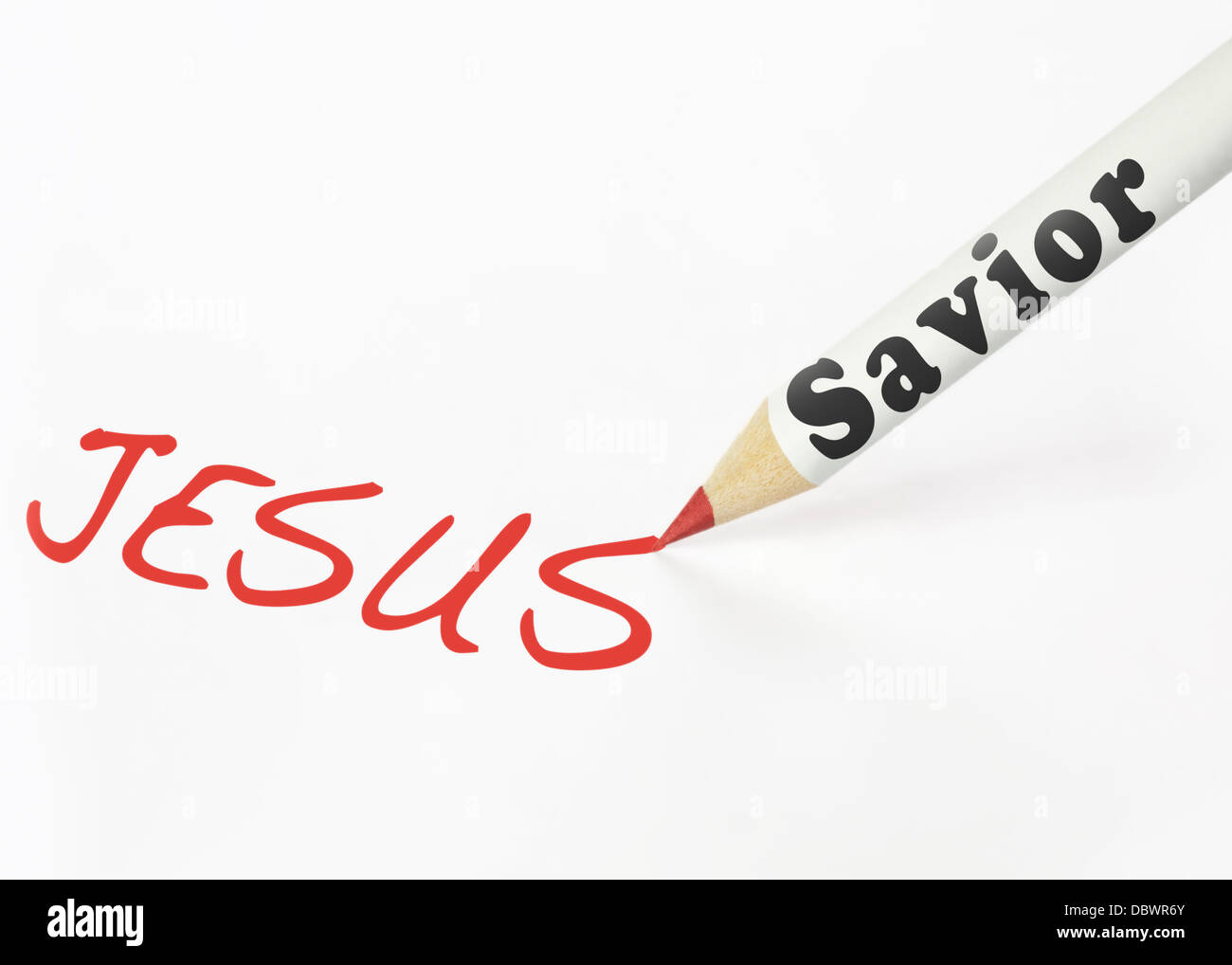 A savior labeled pencil writing the word Jesus Stock Photo - Alamy