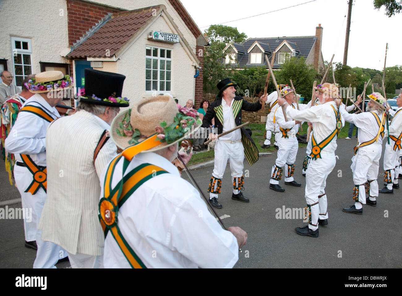 Morris dancers performing in village centre Stock Photo - Alamy