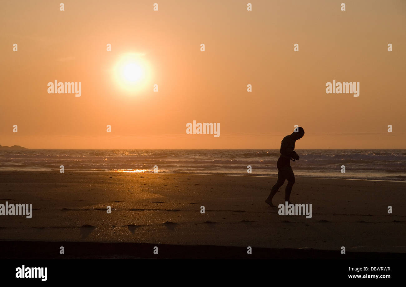 Man running on the beach at sunset in Galicia, Spain Stock Photo - Alamy