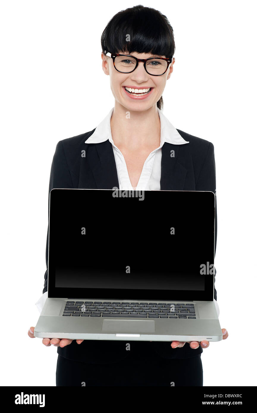 Confident young executive presenting laptop Stock Photo - Alamy