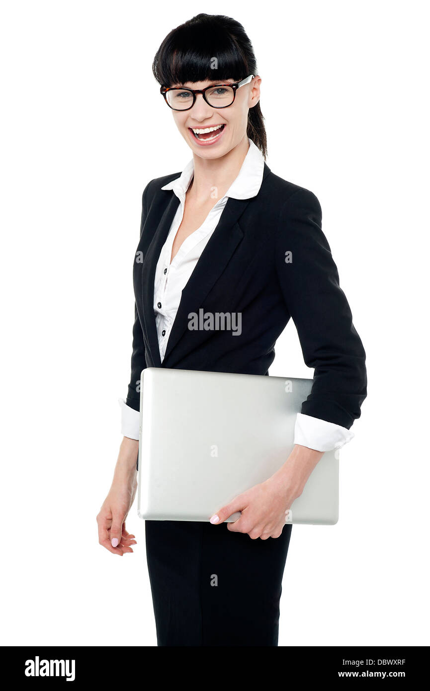 Cheerful office employee holding laptop Stock Photo - Alamy