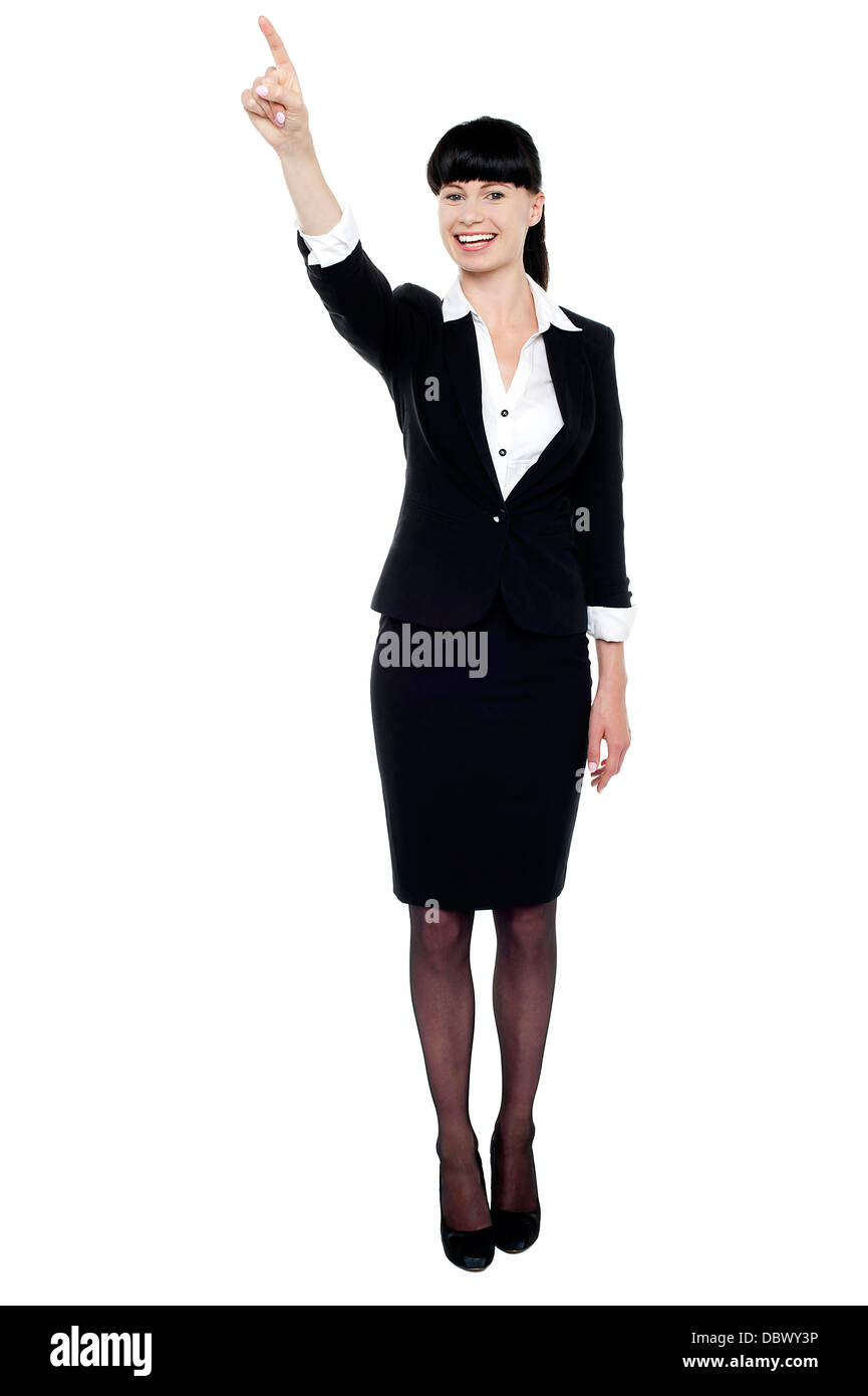 Business lady pointing her finger upwards Stock Photo - Alamy