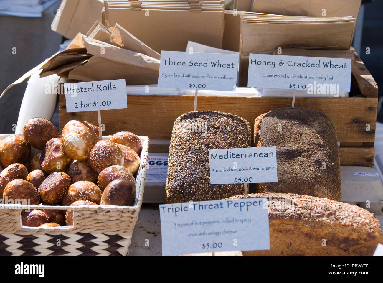 Selection of bread for sale on a stall selling freshly baked produce at ...