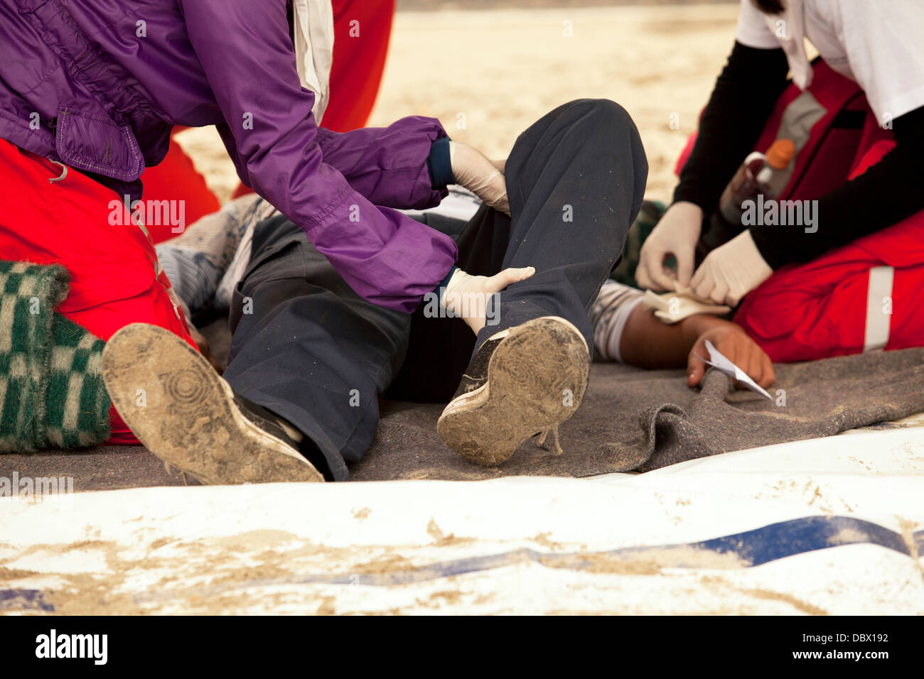 first aid, treatment of leg injury Stock Photo - Alamy
