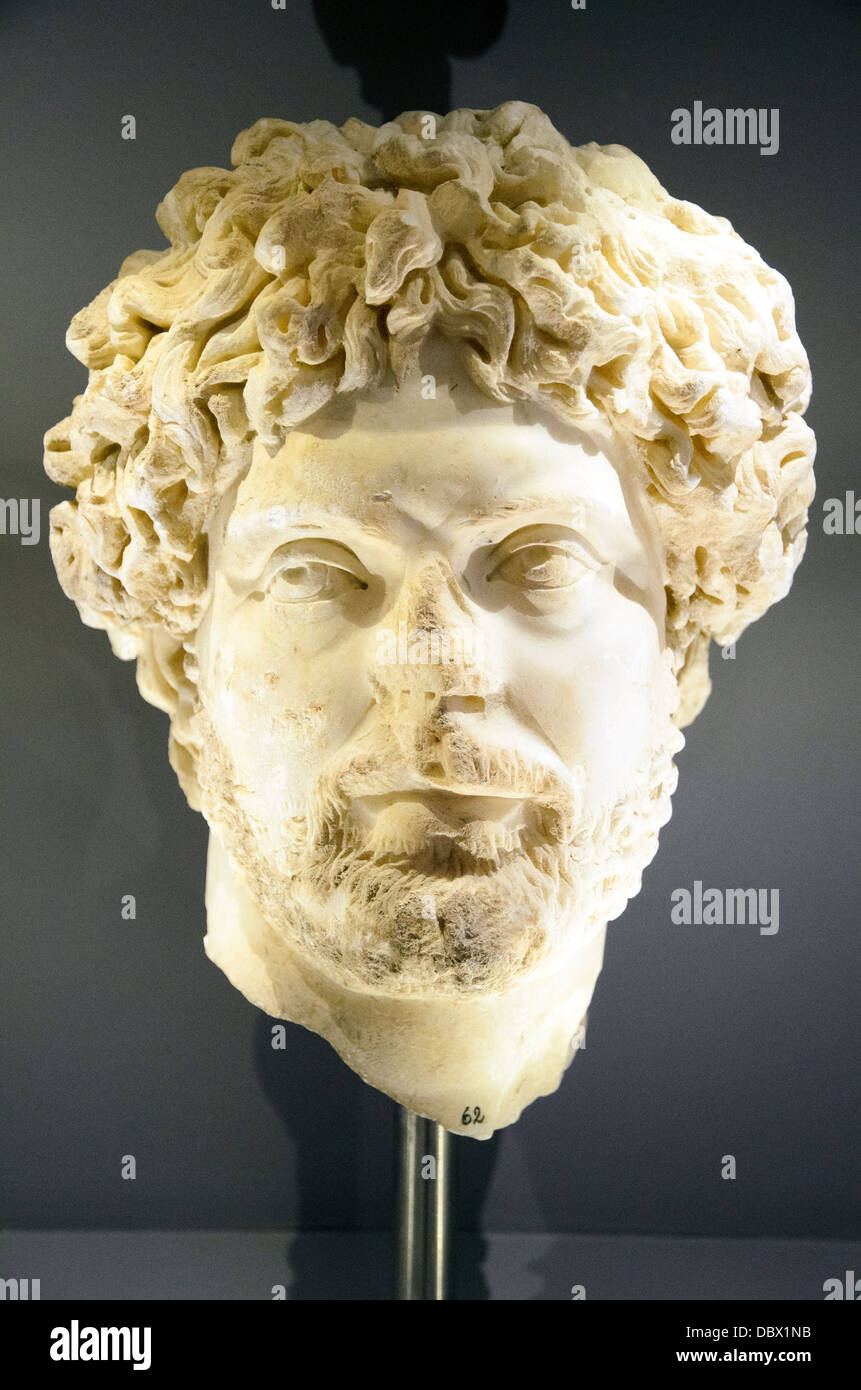 Marble portrait of a man with rich short hair curls and beard ...