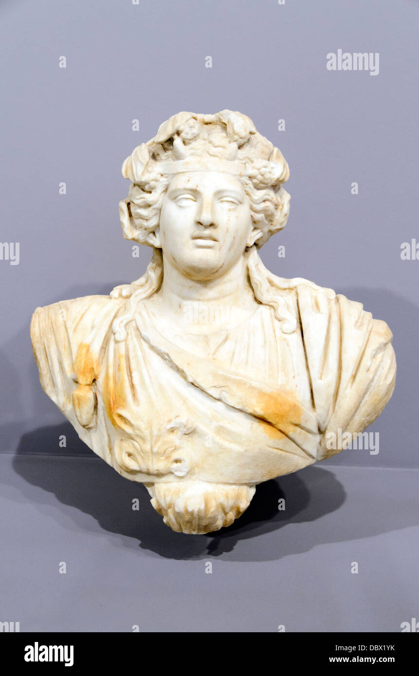 Marble bust of god Dionysus. The god with two small horns on his head ...
