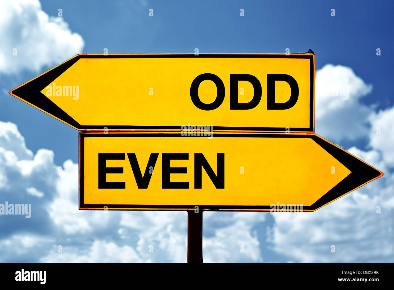 Odd or even, opposite signs. Two opposite signs against blue sky ...