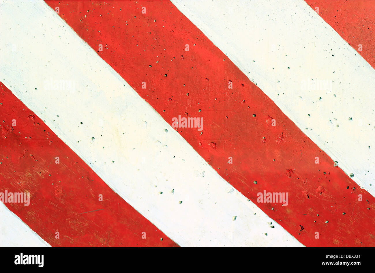 Red and white concrete barrier Stock Photo - Alamy