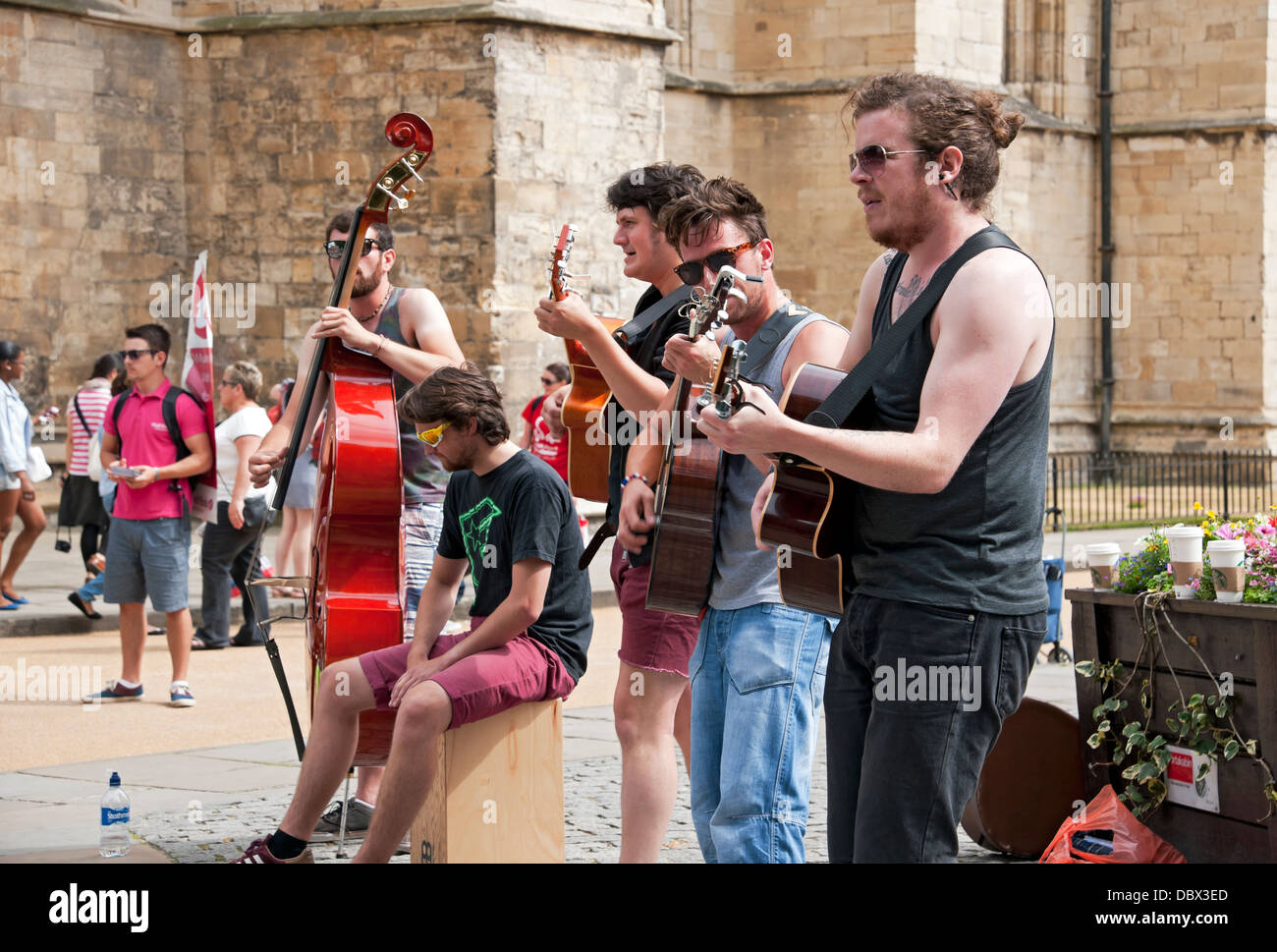 Young men busking hi-res stock photography and images - Alamy