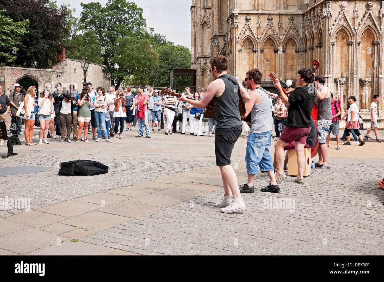 Young men busking hi-res stock photography and images - Alamy